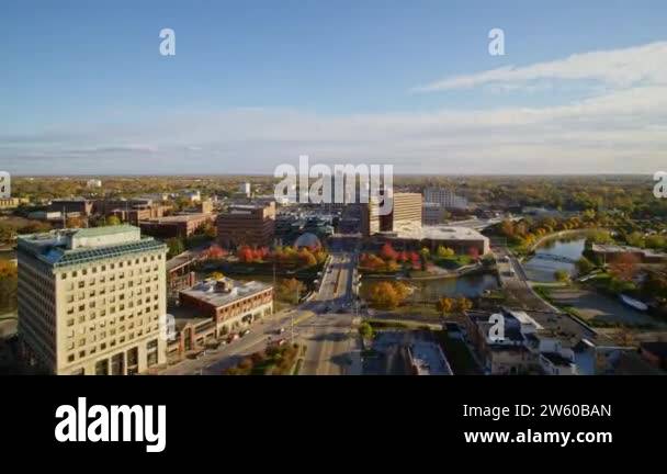 Flint Michigan Aerial v4 Flying into downtown over river to reverse ...