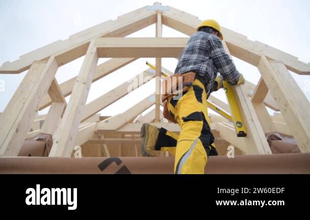 Construction Worker Making Sure Having All Beams Levels Correct. Using Spirit Level Tool ...