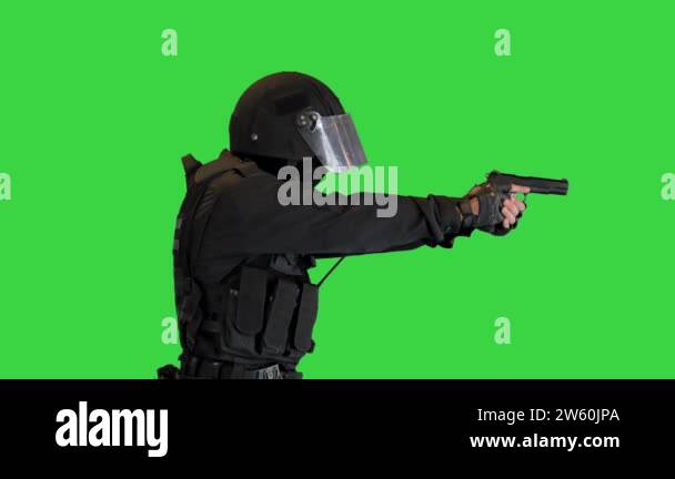 Swat agent running and aiming with a gun on a Green Screen, Chroma Key ...