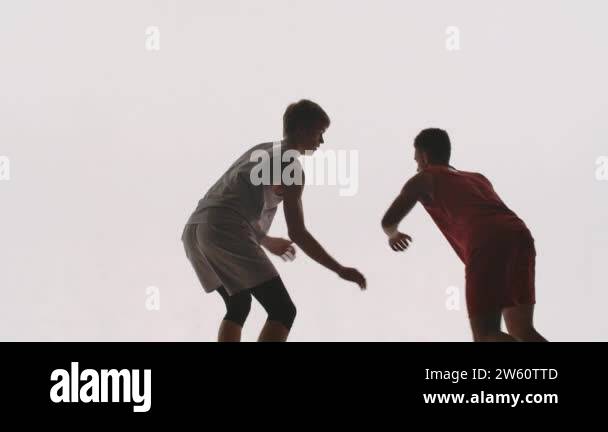 Two guys basketball players practice ball possession in training ...