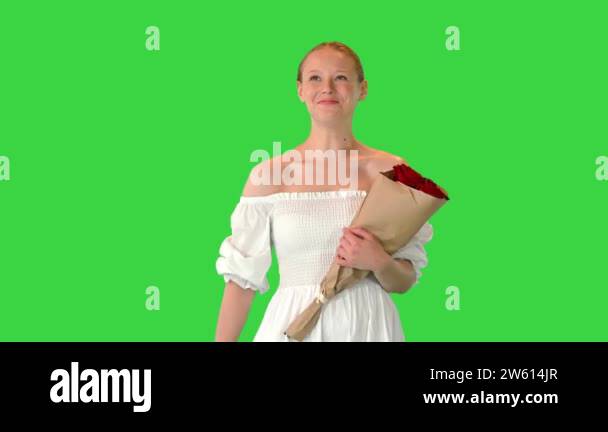 Dreamy young girl with beautiful bouquet walking on a Green Screen ...