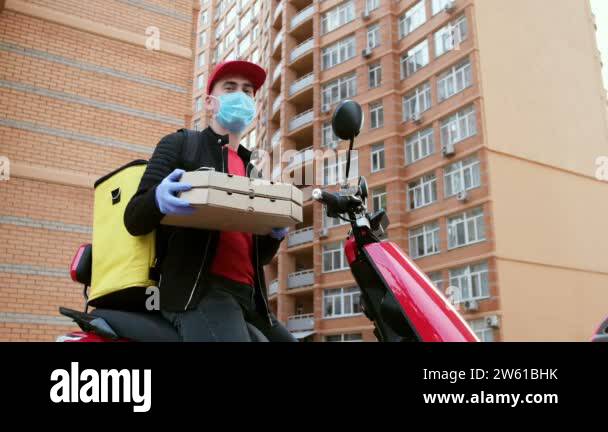 Man on moped boxes Stock Videos & Footage - HD and 4K Video Clips - Alamy