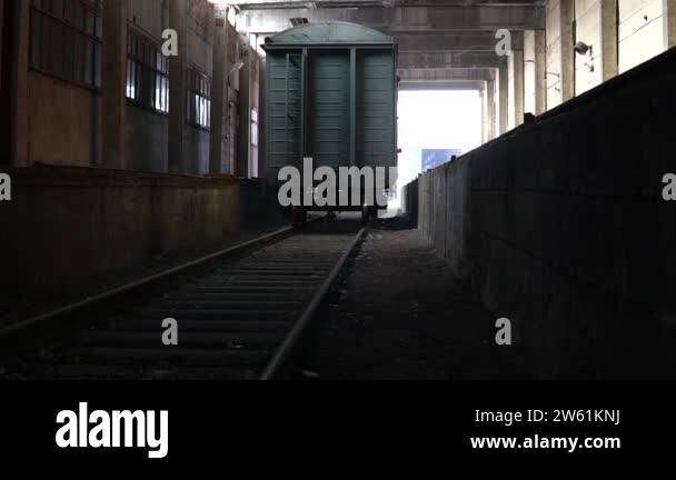 Freight train boxcar with cargo containers at railway dead end storage ...