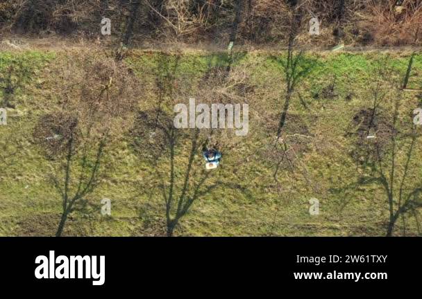 Above top view, on gardener is using modern spray machine, with motor ...
