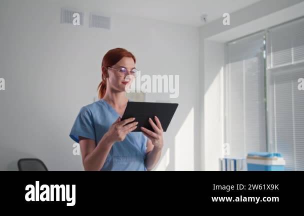 hidden surveillance camera, female doctor wearing glasses checks ...