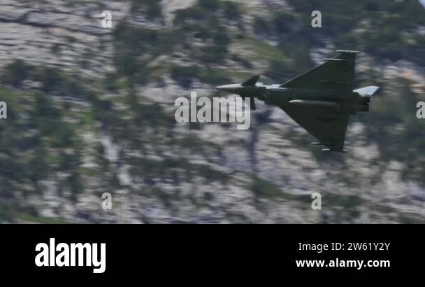 Combat jet plane make a turn with full afterburner and pull up close to ...
