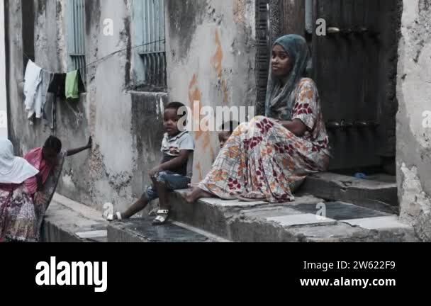 Poor African Family with Mother and Children in Slums of Stone Town ...