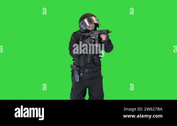 Police operator with assault rifle black uniforms aiming and shooting ...