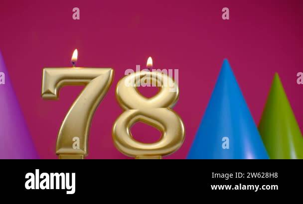 Burning birthday cake candle number 78. Happy Birthday background ...