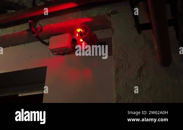 alarm system in the bunker. a red burning siren on the door. red lights ...