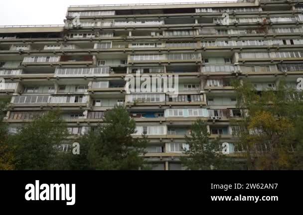 The facade of a high-rise residential building with unusual balconies ...