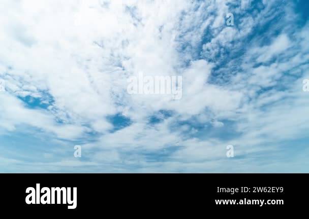 Abstract Building motions clouds. Puffy fluffy white clouds sky time lapse. slow moving clouds ...