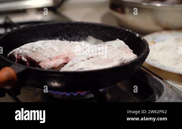 Carp fish is fried in a pan. Freshwater fish crucian carp. Recipe ...