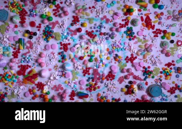 Candy in variety of colour, shape, size and flavours mixed on the table ...