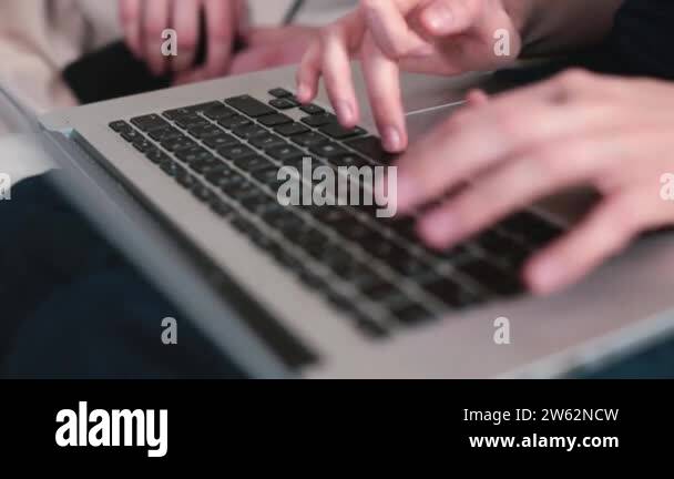 Close-up hands typing words laptop keyboard. Preparing text message in ...