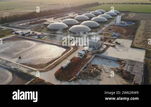 Biogas plant surrounded by nature. Modern storage tanks on biogas farm ...