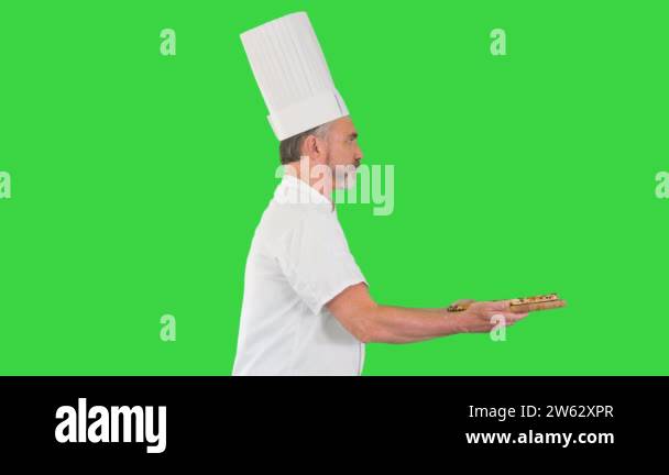 Chef walking fast with pizza on a Green Screen, Chroma Key Stock Video ...