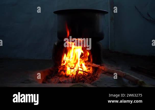Golden yellow flamings in Traditional stove with wood sticks. Fire ...