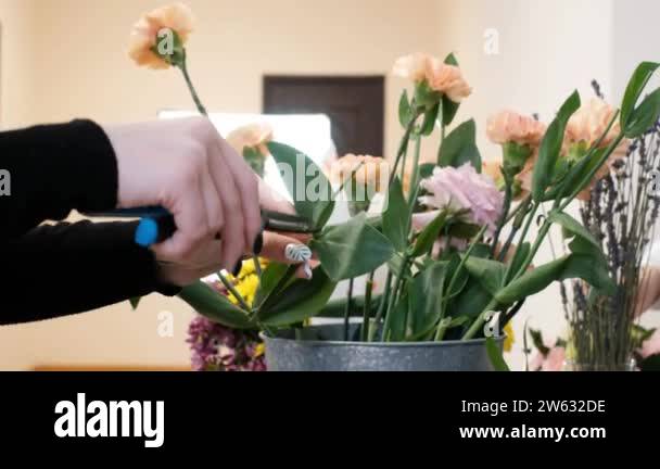 Close-up. Female florist makes floral design. The practice of making ...