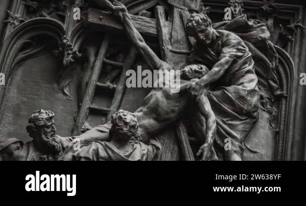 Statues of crusified Jesus and two criminal bandits filmed in close up ...