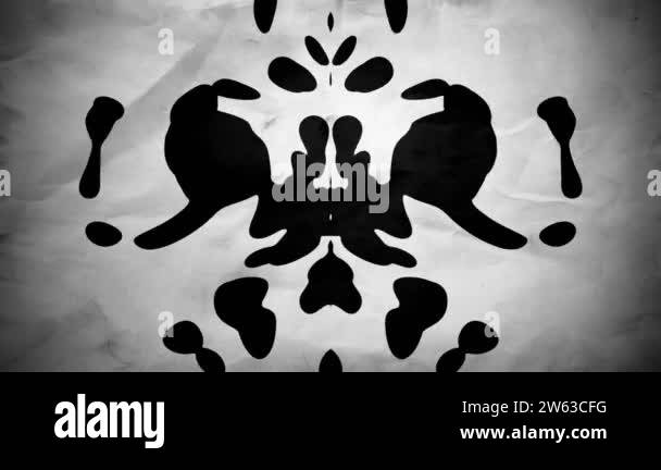 Rorschach Ink blot test on paper with spotlight Stock Video Footage - Alamy