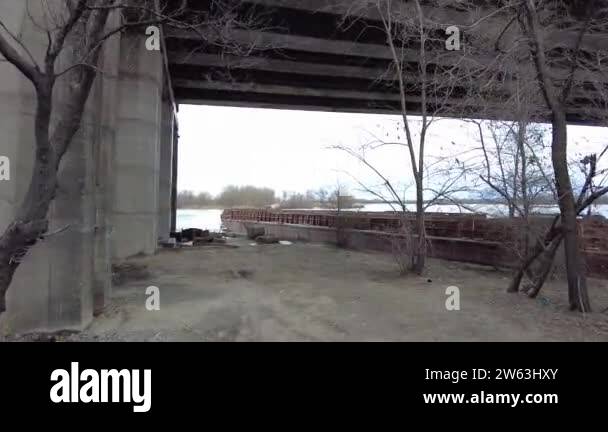 under the big bridge. Powerful iron bridge structure, View from below.A ...