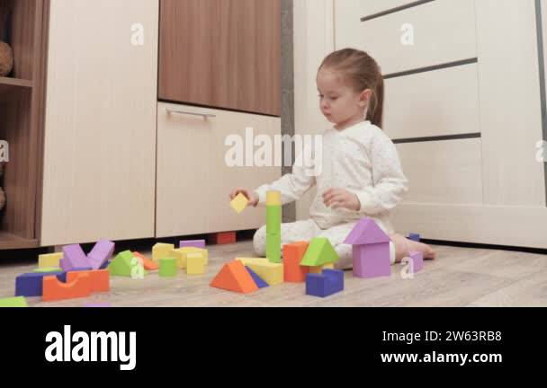 The kid is building a family house. Educational games for development ...