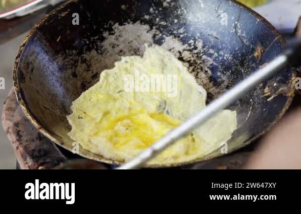 Pad Thai, Stir Fried noodle Thai style with prawns and egg wrap in hot ...
