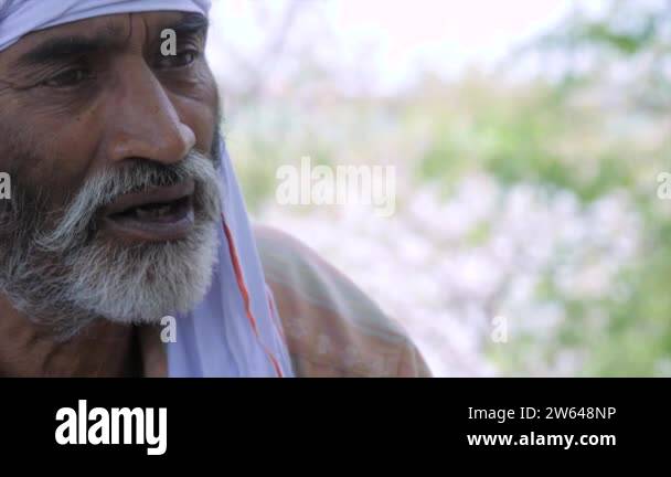 Old man from rural India wearing a Safa. An Indian villager in ...