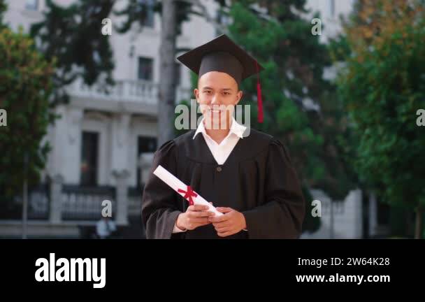 One cap gown holding diploma Stock Videos & Footage - HD and 4K Video ...
