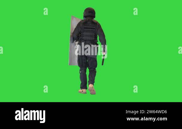 Riot police unit walking with a shield and baton on a Green Screen ...