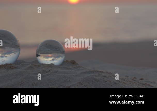 Three clear crystal balls of three sizes are sphere reveals seascape ...