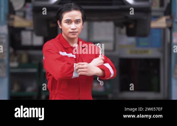 portrait of worker asian man staff of auto service standing confident ...