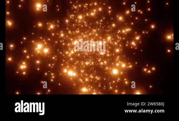 Abstract motion background shining gold particles. Shimmering glittering particles fly in the ...