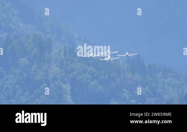 Four Pilatus PC-9 turboprop training military airplanes fly in diamond ...