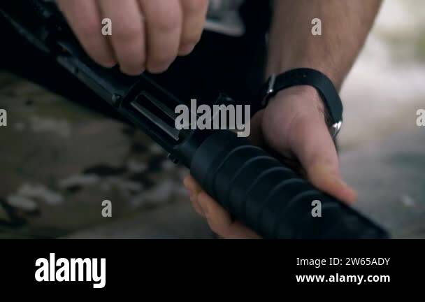 Charging pump-action shotgun with shotguns. Reload shotgun bullets. A ...