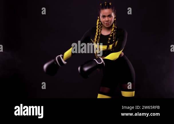 Boxing sport concept. Woman with yellow braids dancing on black ...