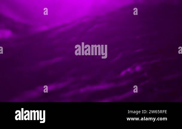 waving crumpled plastic texture with a purple neon light texture ...