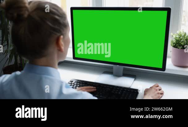 woman using desktop computer in office, scrolling mouse. mockup with ...