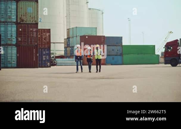Industrial Engineers Walk in Container Terminal Stock Video Footage - Alamy