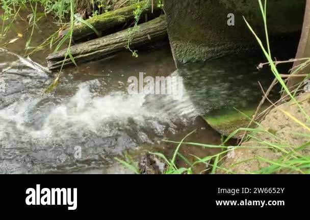 Waste water,mud flows from the pipe into the river,environmental ...