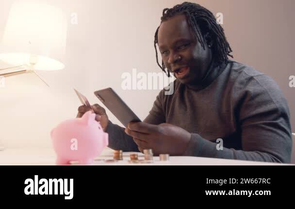 African american black man checking bank balance using mobile app ...