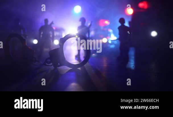 Police raid at night and you are under arrest concept. Silhouette of ...
