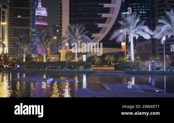 West bay skyscrapers in Doha Qatar zooming in and panning night shot ...