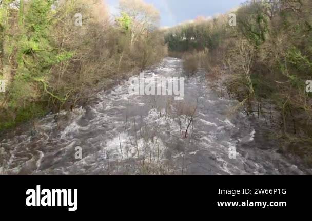 Winter flood water and a rainbow on the River Dee, released from ...