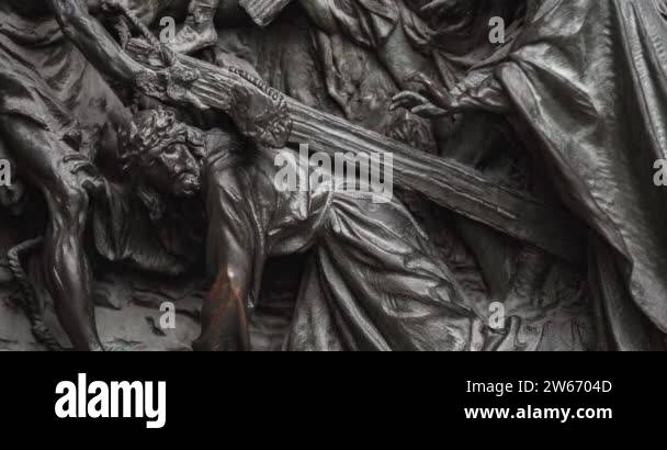 Statues of crusified Jesus and two criminal bandits filmed in close up ...