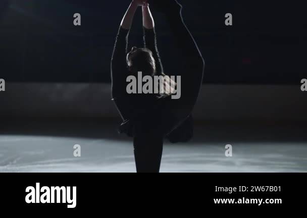 Biellmann spin in single female figure skating, young sportswoman is ...