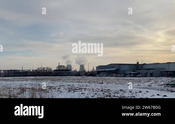 The pipe emits polluted smoke into the atmosphere. Acrid smoke billows ...