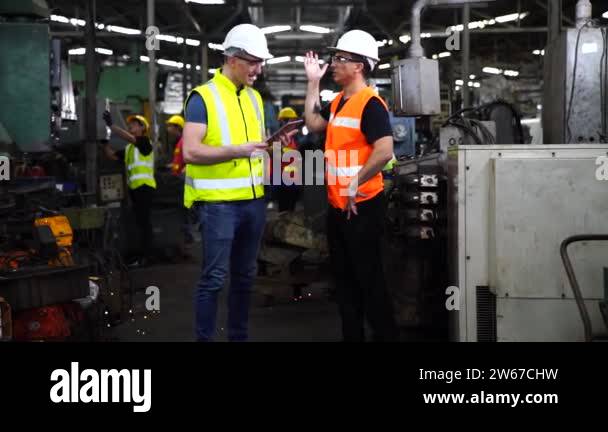 Manufacturing worker using Computer Tablet in factory. Asian worker ...
