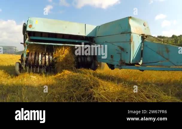 Combine harvesting wheat straw baler Stock Videos & Footage - HD and 4K ...